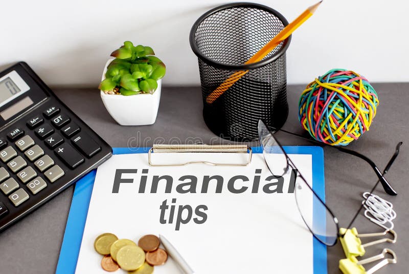 FINANCIAL TIPS Written on the Paper with Office Tools Stock Photo ...