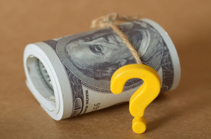 Financial Uncertainty: Rolled US Dollar Bills with Question Mark Stock ...