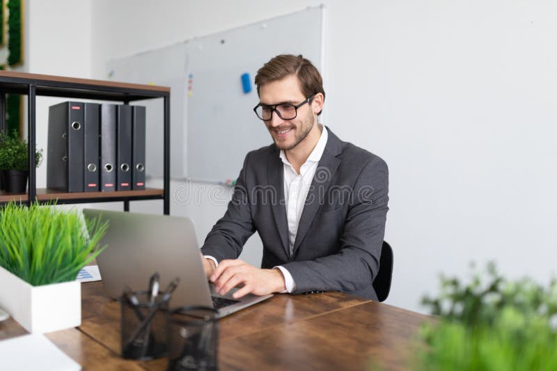 Financial Worker Working on Business Task while Sitting with Laptop ...