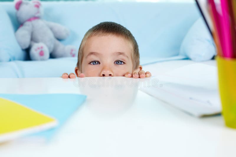 Child Peeking Over Table stock photo. Image of head, home - 20172218