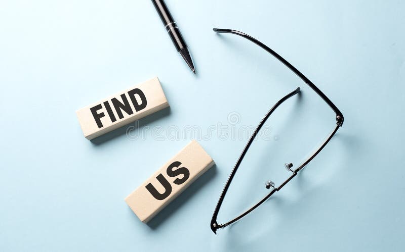 FIND US Text on the Wooden Block ,blue Background Stock Image - Image ...