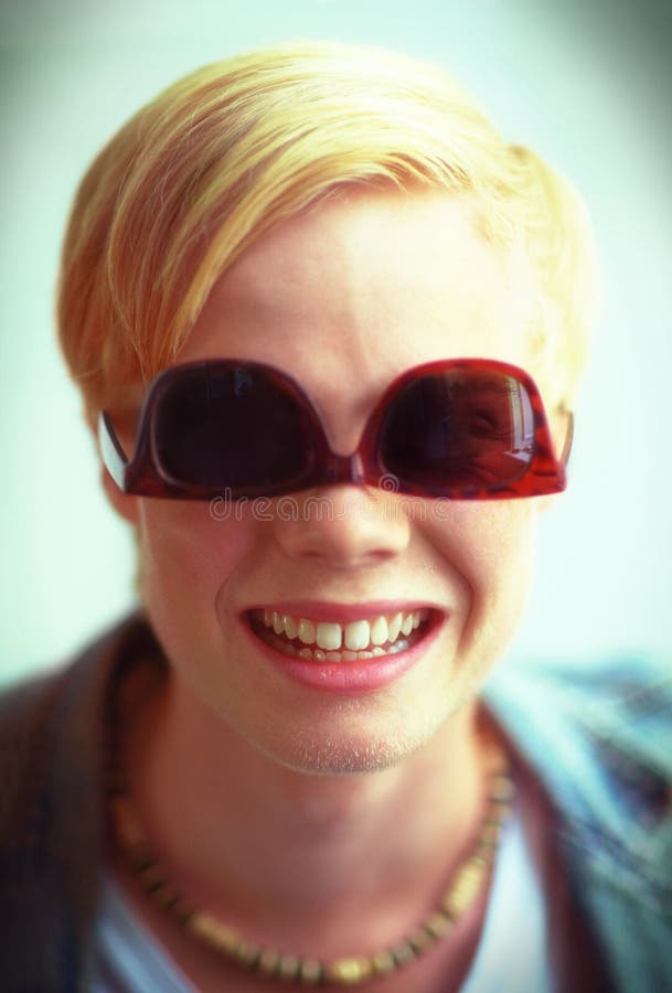 Finding The Humor In Life Smiling Young Blonde Guy With His Hipster Shades On Upside Down