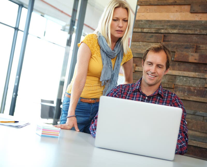 Finding Solutions Together. Two Designers Working on a Laptop in an ... Finding Solutions Together. Two Designers Working on a Laptop in an ...