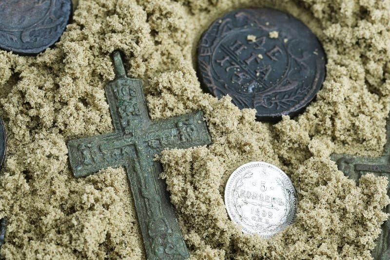 Finding Treasure Hunter on the Sand, the Old Crosses between Them a ...