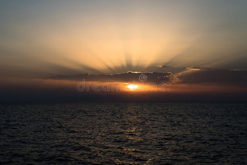 Fine Beams of the Sun at Sunset at the Sea Stock Photo - Image of ...