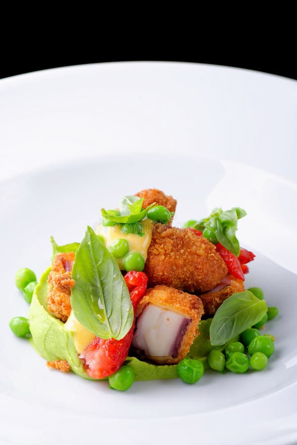 Fine Dining, Fried Octopus on Basil Mousse, Green Peas Stock Photo ...