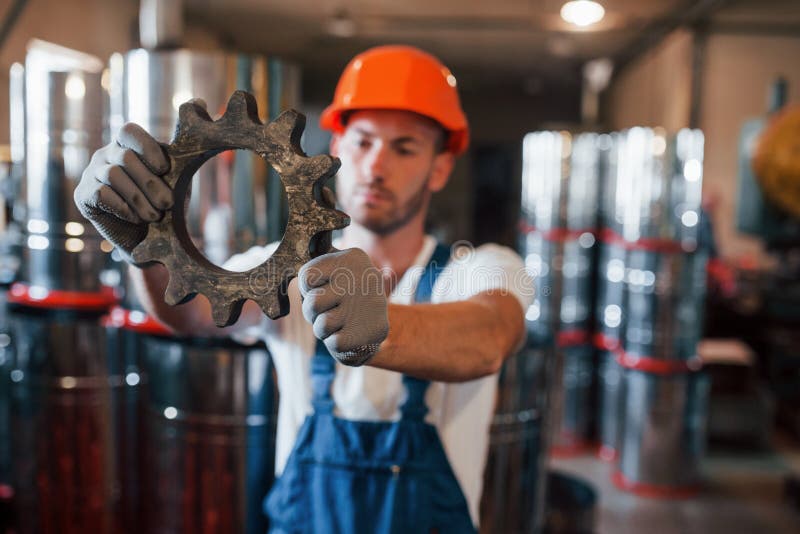 Fine Material. Man in Uniform Works on the Production Stock Photo ...