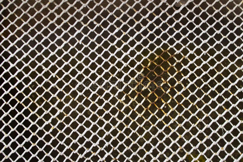 Fine Metal Grill Painted with White Paint with a Rusty Spot Background ...