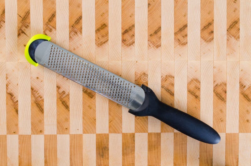 A Fine Rasp on a Cutting Board Stock Image - Image of held, cooking ...