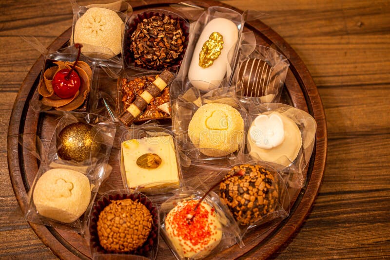 Fine Sweets for Parties with Chocolate and Cherry. Decorated on a ...