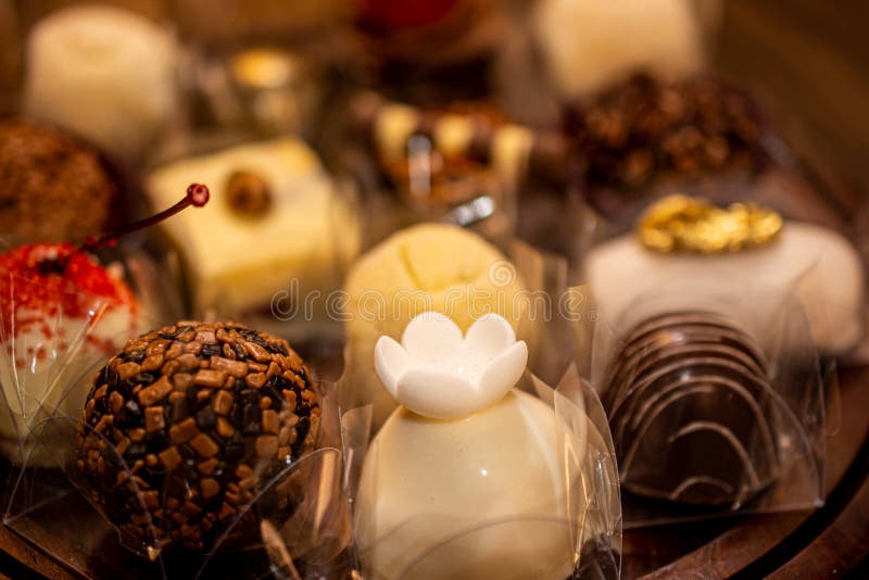 Fine Sweets for Parties with Chocolate and Cherry. Decorated on a ...