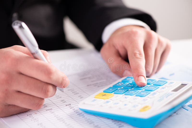 A Finger Adding Up Figures Using a Calculator Stock Image - Image of ...