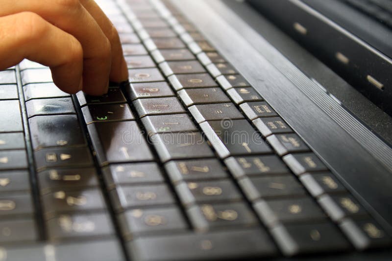 Finger of a Female Hand Press a Key on the Keyboard of the Laptop ...