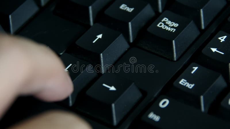A Finger Hitting Computer Keyboard Arrow Signs on PC Keyboard Stock ...