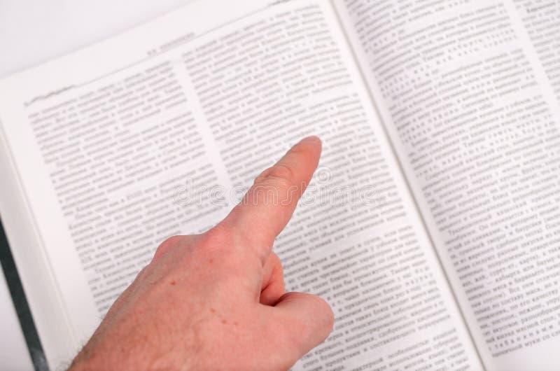 Finger hows an open book. stock image. Image of document - 51040203