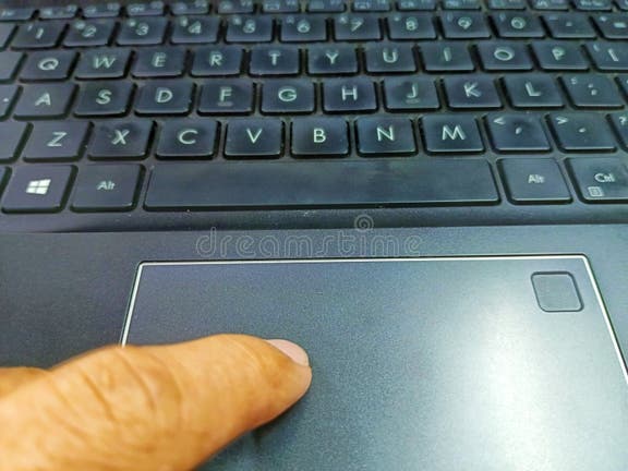 Finger Navigating Touchpad on Computer Keyboard Stock Photo - Image of ...