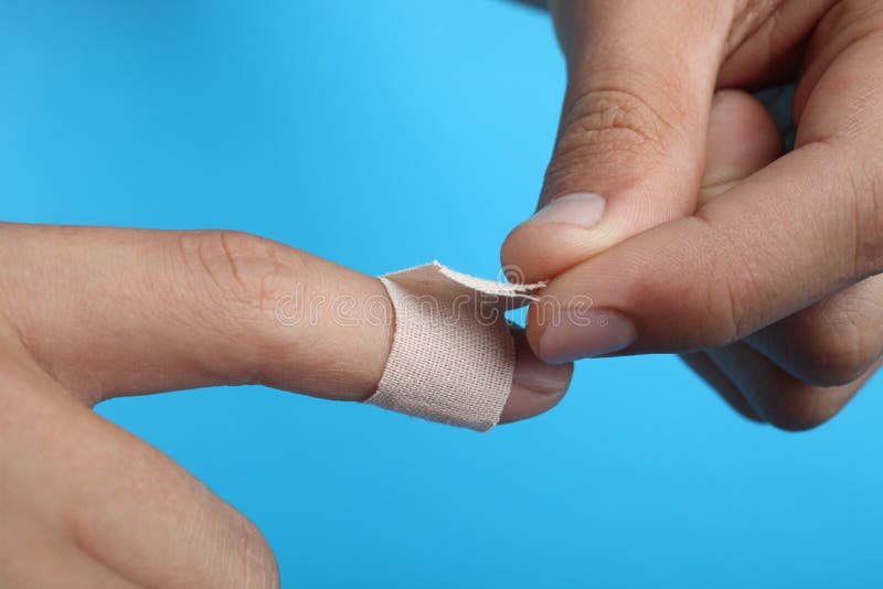 Finger with a plaster stock photo. Image of patch, human - 101009384