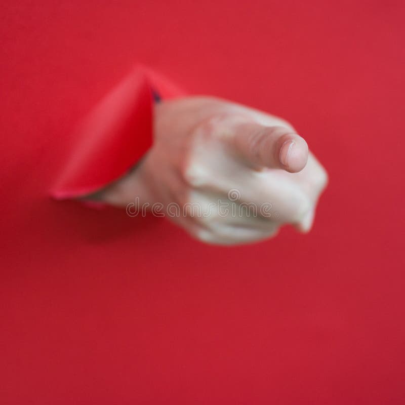 Finger Pointing through Red Paper Stock Photo - Image of concepts, hand ...