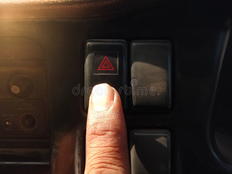 Finger Press the Emergency Light Button with the Red Triangle Symbol ...