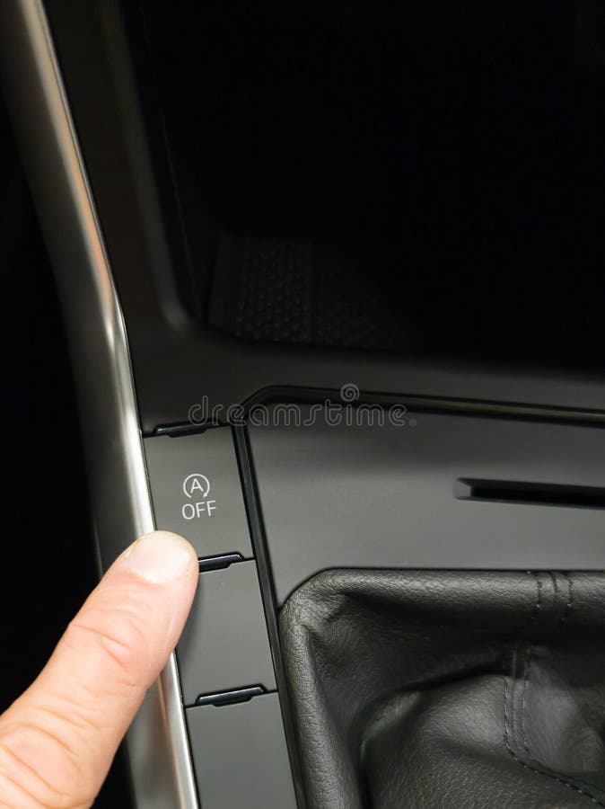 Finger Presses the Automatic Engine Shutdown Shutdown Button for ...