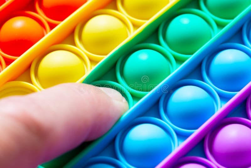 Finger Presses Bubble on Pop it Baby Silicone Toy Stock Image - Image ...