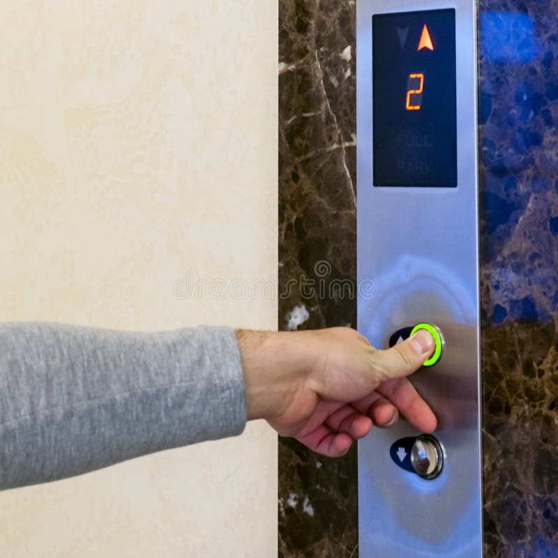 Finger Presses the Elevator Button. Green Button. Hand Reaches for the ...
