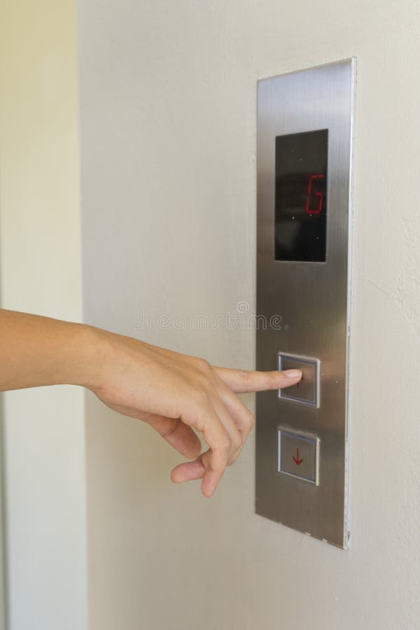 Woman Pressing Elevator Button. Stock Photo - Image of season, national ...