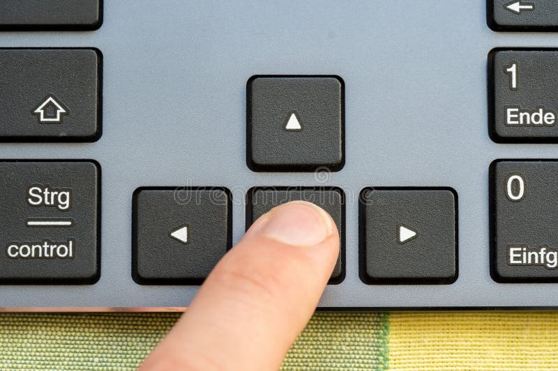 Finger Pressing the Back Arrow Key on a Computer Keyboard, Indicating a ...
