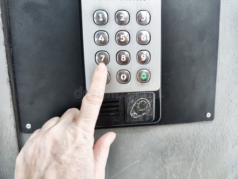 Finger Pressing Button on Intercom System in Elevator during Day Stock ...
