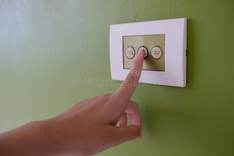 Finger Pressing Door Bell Button on Green Wall Stock Image - Image of ...