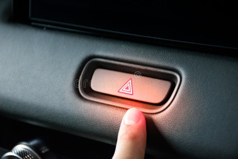 Finger Pressing the Emergency Light Button on a Car To Symbolize a Car ...