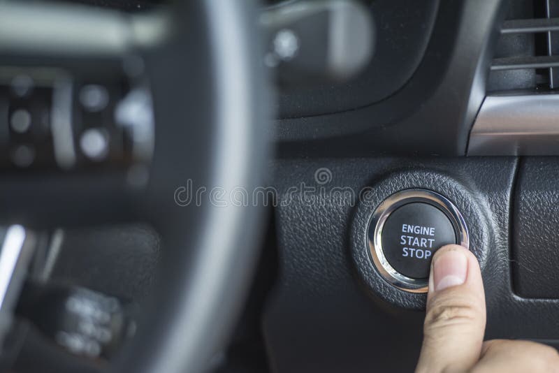 The Finger Pressing the Engine Start Stop Button of a Car Stock Photo ...