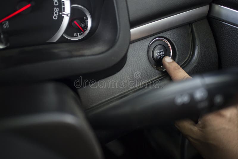 The Finger Pressing the Engine Start Stop Button of a Car Stock Photo ...