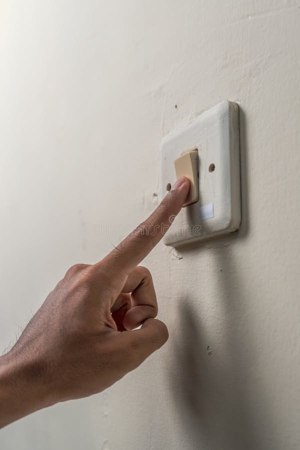 Finger Pressing Light Switch on Wall Indoors Stock Image - Image of ...