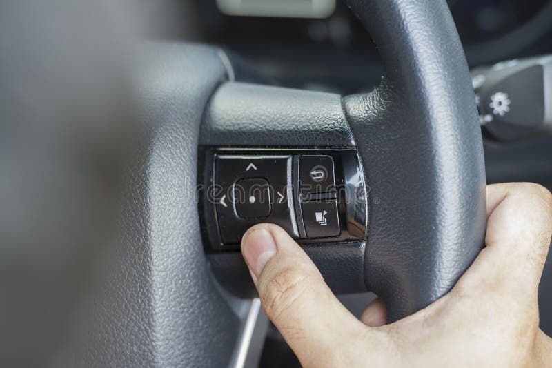 The Finger Push a Button on the Car Steering Wheel Stock Photo - Image ...