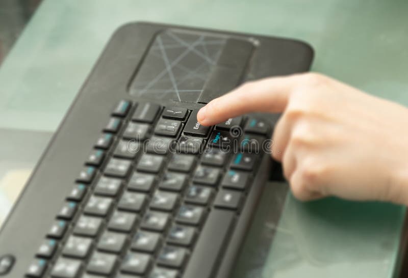 Finger Push Enter Key Button on Wireless Bluetooth Key Board on Glass ...