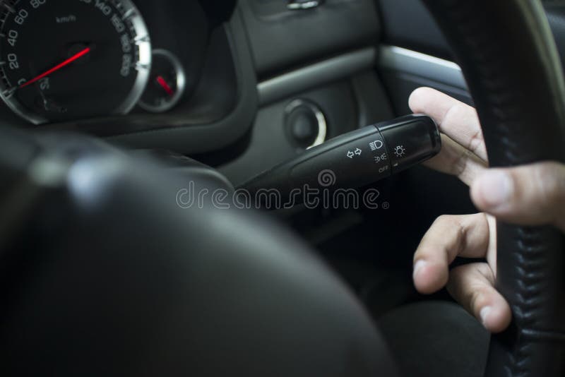 The Finger Push a Lighting Control Button on the Car Steering Wheel ...