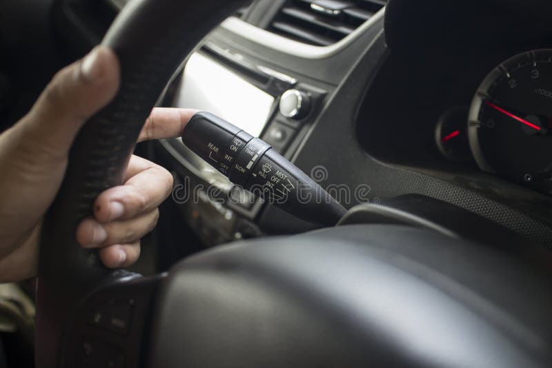 The Finger Push a Wiper Control Button on the Car Steering Wheel Stock ...