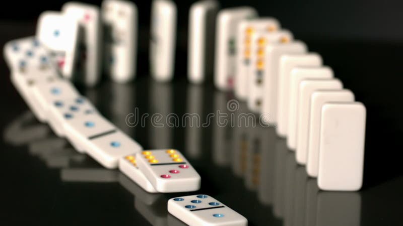 Finger Pushing Over Colourful Dominoes Stock Footage - Video of ...
