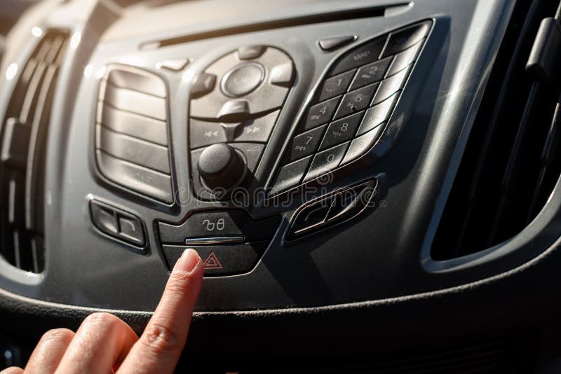 Finger on the Red Triangle Button of a Car`s Hazard Warning Lights ...