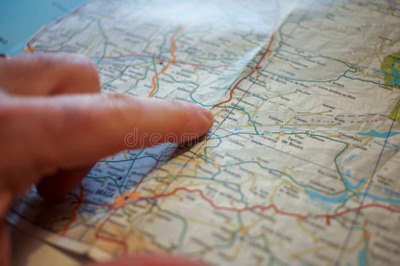 A finger in a road map stock image. Image of concept - 317848101