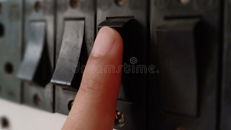 Finger Switching Off the Buttons on the Black Switch Board Stock Image ...
