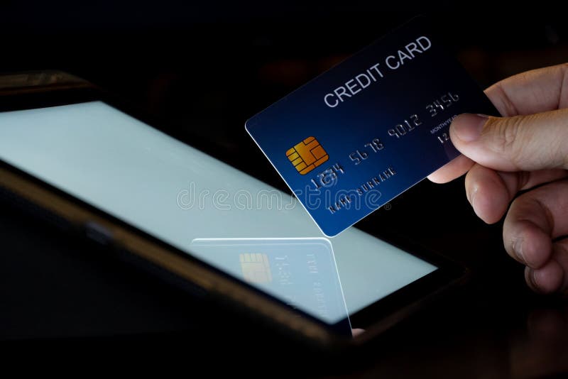 Finger Touch on Tablet Screen Mock Up with Light the Credit Card. Stock ...