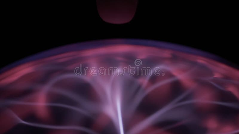 A Finger Touching Plasma Ball, Creating Energy Rays. Slow Motion Stock ...