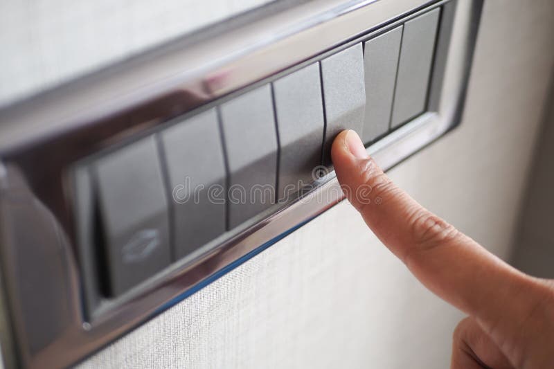 A Finger Turning on Lighting Switch . Stock Photo - Image of room ...