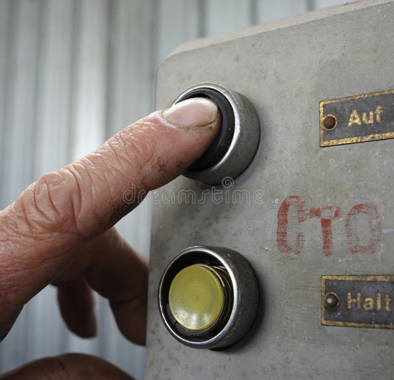 Finger of Worker Pushing Button Open on a Control Panel Stock Photo ...
