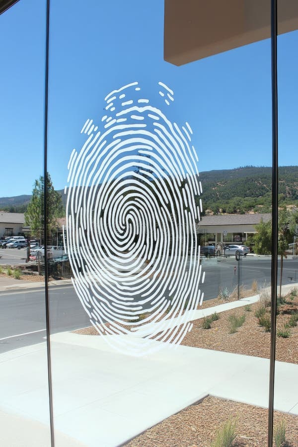 Fingerprint Artwork on Glass Reflecting Urban Landscape and Mountains ...