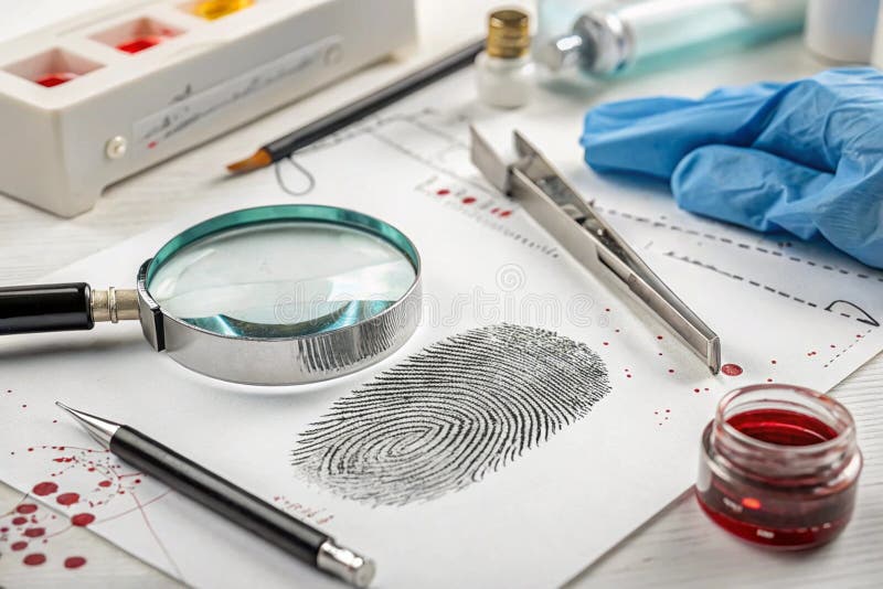 Fingerprint Under Magnifying Glass with Forensic Tools and Evidence ...