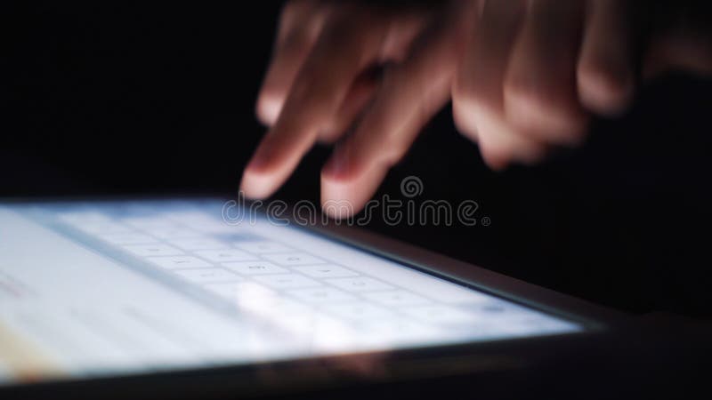 Fingers of Child Texting Message on Tablet in the Dark Stock Video ...