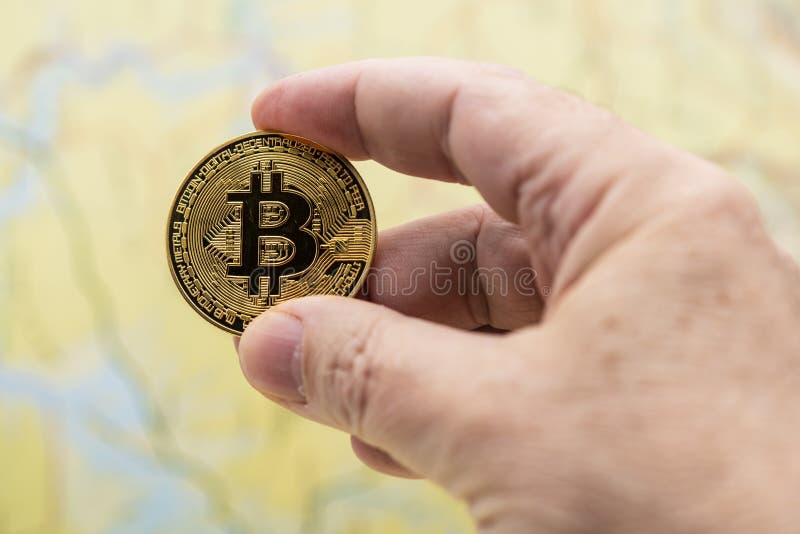 Fingers of a Hand Holding a Bitcoin Cryptocurrency Stock Image - Image ...
